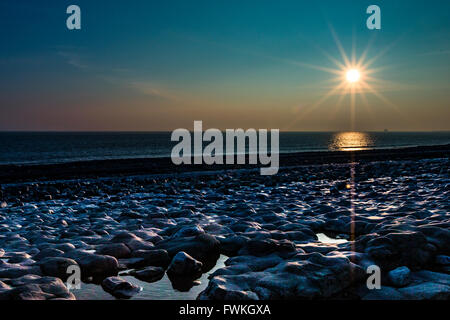 A Sunset, at Rhoose Point, Wales, Rocky Beach Stock Photo - Alamy