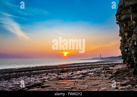 A Sunset, at Rhoose Point, Wales, Rocky Beach Stock Photo - Alamy