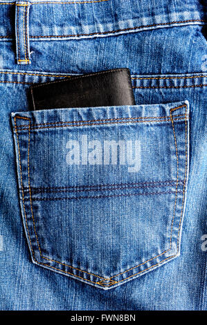 Blue worn jeans pocket close up, ripped jeans pocket background, dark ...