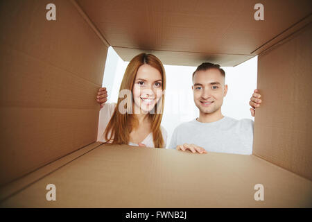 happy man opening parcel box at home Stock Photo - Alamy