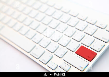 perspective of red return button on white modern keyboard Stock Photo ...