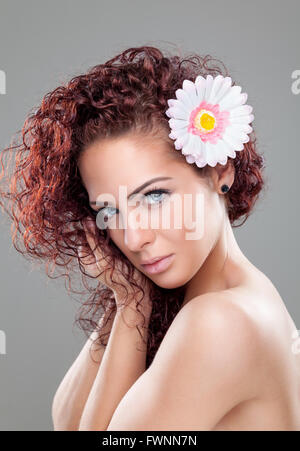 Young beautiful woman with curly hair wearing white t-shirt Punching ...
