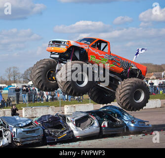 The Podzilla monster truck jumping cars during a live performance at ...