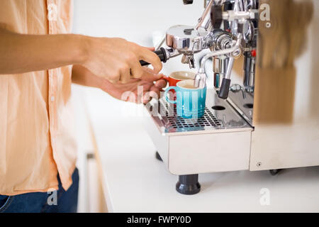 Man preparing coffee from coffeemaker Stock Photo - Alamy