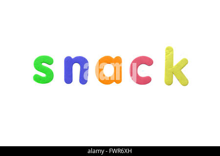 The word snack made from alphabetic fridge magnets photographed against ...