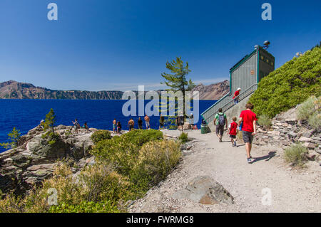 Tourists walk by the rim of the crater of Mount Vesuvius in Campania ...