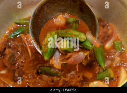 Cooking A famous Sudanese Okra dish called Bamia Tabalia Stock Photo ...