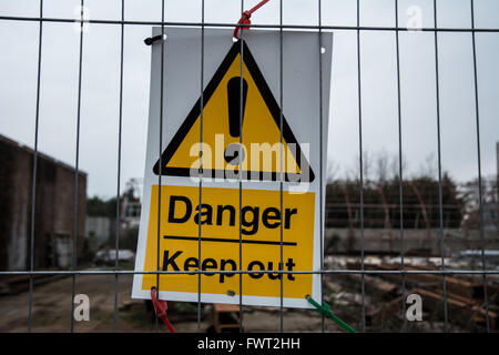 Warning Dangerous Buildings Keep Out sign on building Stock Photo - Alamy