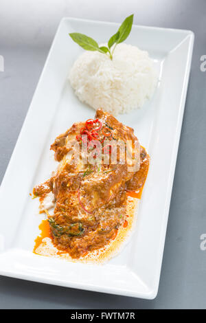 Chicken fillet red curry with jasmine rice Stock Photo - Alamy