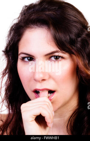 Woman biting thumb, portrait Stock Photo: 12871399 - Alamy
