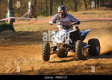 Quad rider when accelerating out of a turn Stock Photo - Alamy