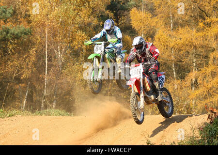 Two dirt bike racers jumping tabletop Stock Photo - Alamy