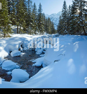 Small mountain stream with snowdrift on stones Stock Photo - Alamy