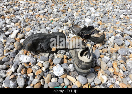 old shoe washed up on river back Stock Photo - Alamy