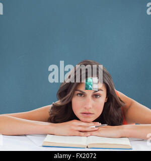 Frowning student head on her books Stock Photo - Alamy