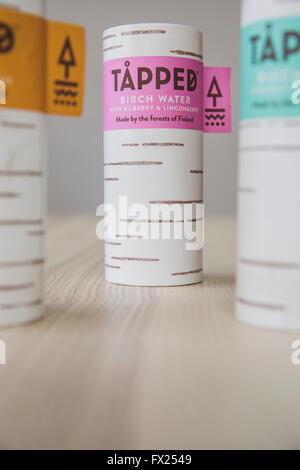 Tapped Birch water cartons on a wooden kitchen table in natural light ...
