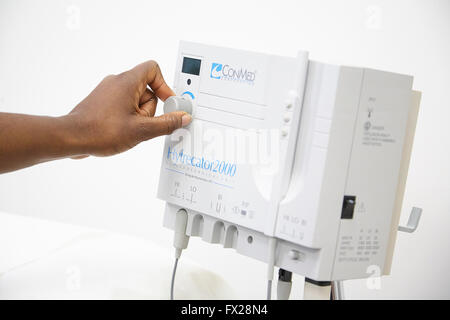 Person operating a hyfrecator 2000 in a hospital, used for various ...