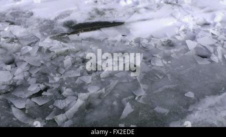 Large chunks of ice on the street Stock Photo - Alamy