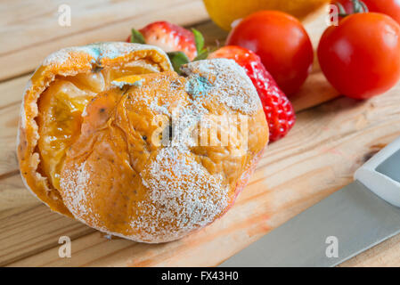 mandarin with mold on the wooden table Stock Photo - Alamy