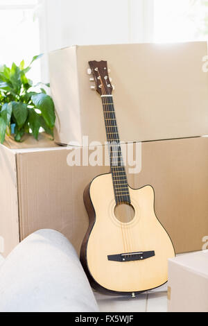 Guitar and cardboard boxes Stock Photo - Alamy