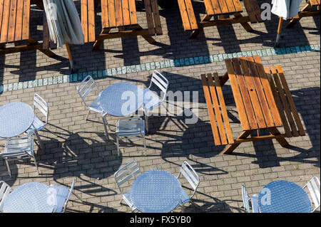 Empty chairs and tables are seen outside a Vincent cafe coffee shop in ...
