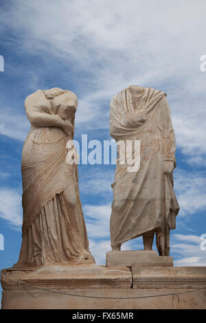 View of a stone anthropomorphic figure statue, surrounded by trees and ...