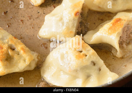 fried meat dumplings on pan Stock Photo - Alamy