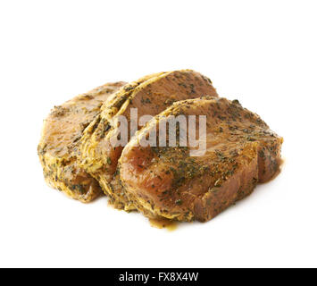 three raw juicy pork slices of meat on the rib, food lies on brown ...