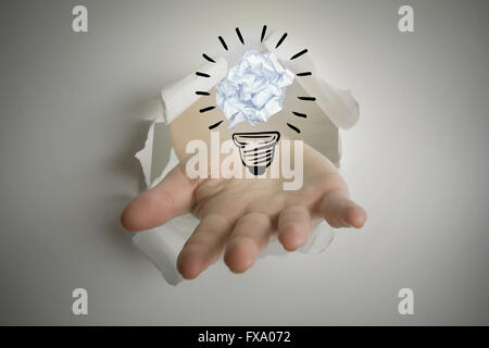 Composite image of hand bursting through paper Stock Photo - Alamy