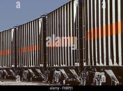 railroad transportation, freight cars in industrial seaport at sunset ...