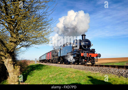 Ivatt Class 2 tank engine with a typical 1950's mixed branch line train ...