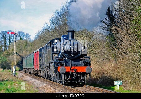 Ivatt Class 2 tank engine with a typical 1950's mixed branch line train ...