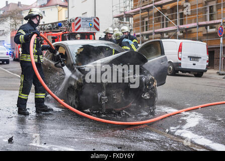 Fire department extinguishing a burning Corsa, burnt engine compartment ...
