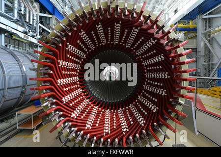 A Siemens employee works on a generator stator at the Siemens Power ...