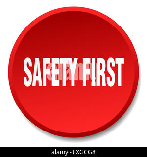safety first round red sticker isolated on white Stock Photo - Alamy