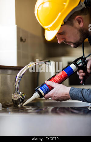 Pest control man using pest control injection Stock Photo - Alamy