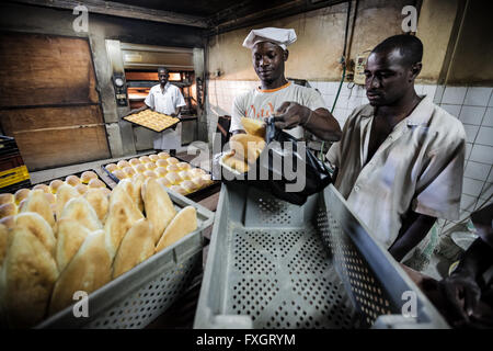 Mozambique, men are baking bread in bakery traditional cousin Stock ...
