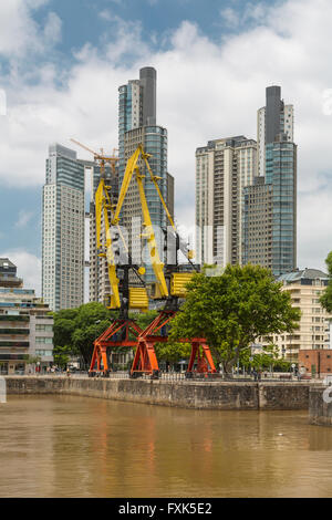High-rise buildings and decommissioned cranes at the waterfront ...