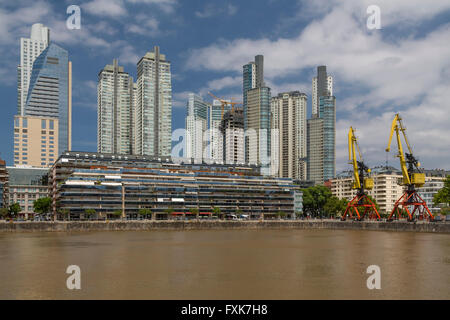 High-rise buildings and decommissioned cranes at the waterfront ...