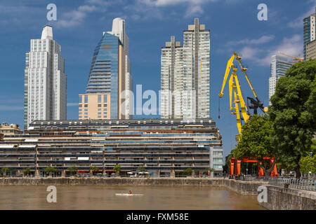 High-rise buildings and decommissioned cranes at the waterfront ...