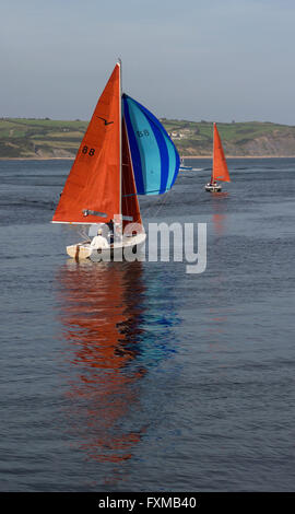 Sailing boat with two red sails and spinnaker on the Riviere d'Auray ...