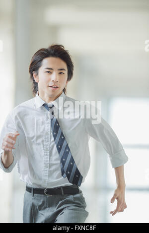 Male high school student running away from school Stock Photo - Alamy