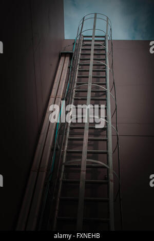 Ladders on the roof of a tall building with a view below Stock Photo ...