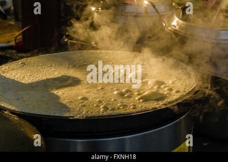 Crepe cooker with bubbling crepes at a market stall. Beaverton, Oregon ...