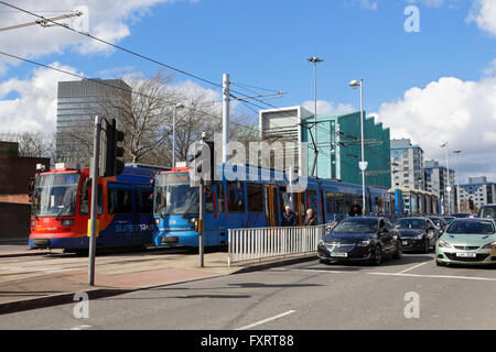 Sheffield Supertrams alongside road vehicles, Sheffield city centre ...