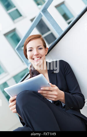 student working on tablet computer at university school modern interior ...