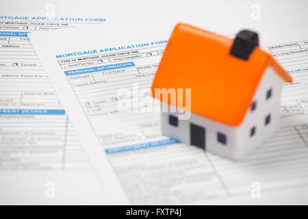 Foam house on top of mortgage application form Stock Photo - Alamy