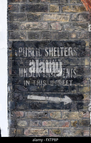 Faded World War II sign showing location of public air raid shelters ...