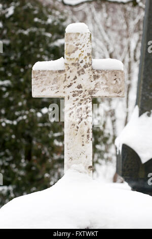 Old concrete christian cross tombstone on a cemetery graveyard burial ...