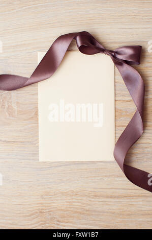 close up of a note card with ribbon bow on white background Stock Photo ...